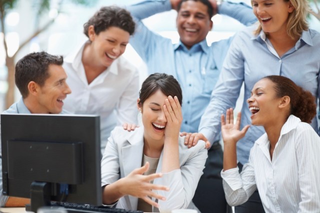 Laughing Office Workers 105 Funny Work Quotes That Will Make Your
